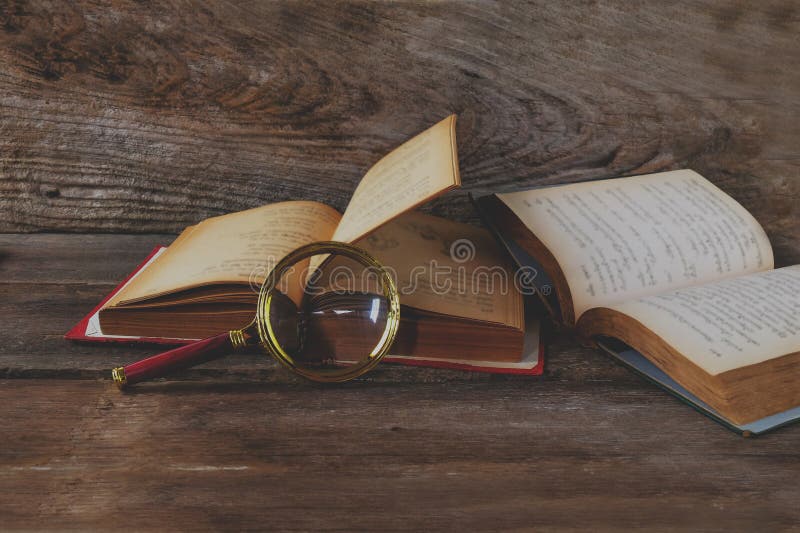 Vintage Magnifying Glass with Old Books. Concept for Learn Stock Image ...
