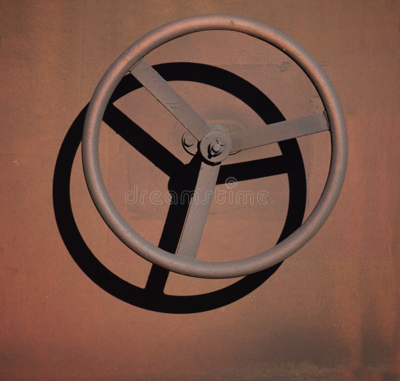 Vintage Metal Wheel with Sharp Shadow Stock Image - Image of corroded ...