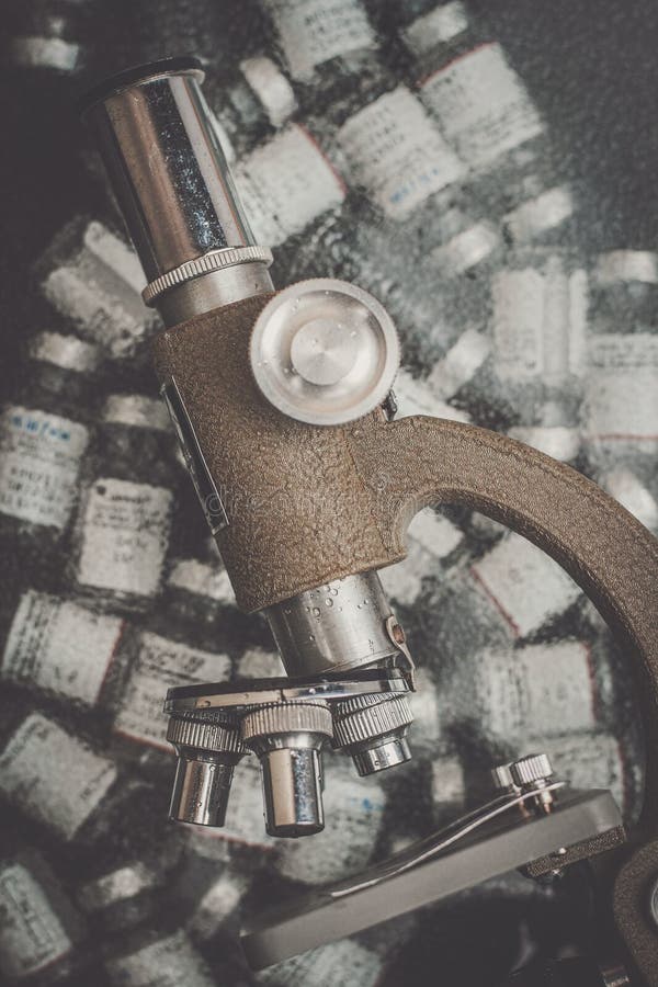 Vintage Microscope Stands with a Collection of Small Medicine Viles in ...