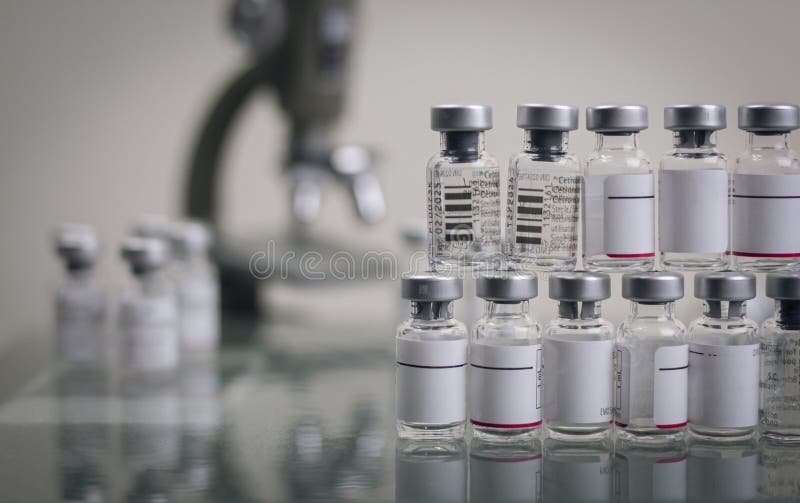 Vintage Microscope Stands with a Collection of Small Medicine Viles in ...