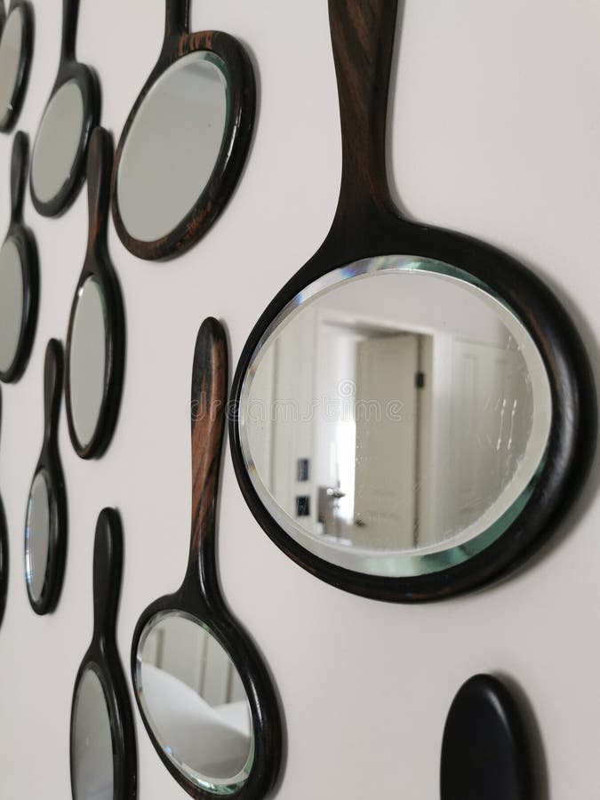 Vintage Mirrors with Reflection on the Door on White Wall Stock Photo ...