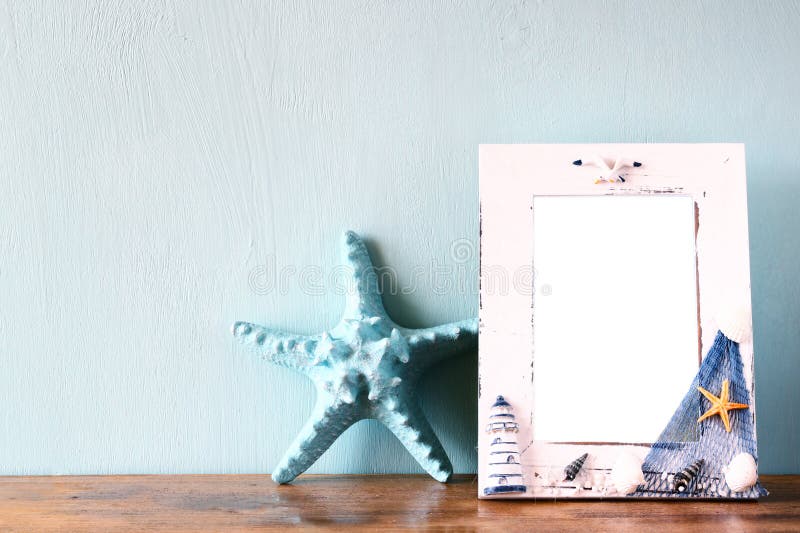 Vintage Nautical Frame with Starfish on Wooden Table. Retro Filtered ...