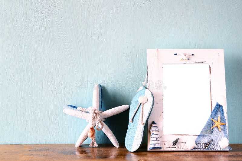 Old Nautical Frame with Starfish on Wooden Table and Wooden Background ...