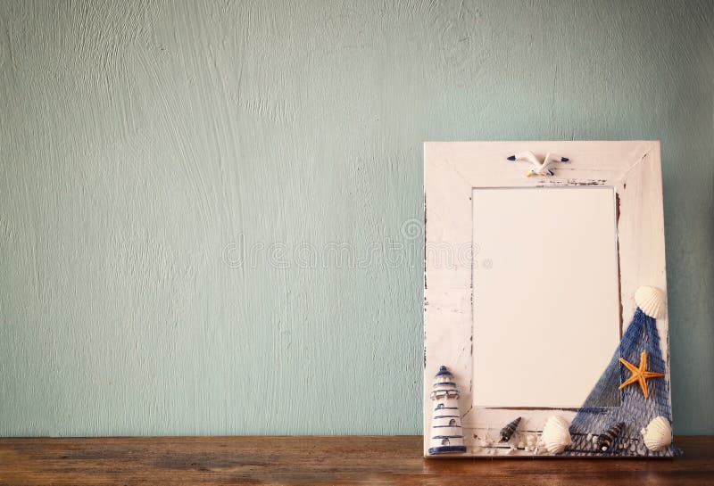 Old Nautical Frame With Starfish On Wooden Table And Wooden Background ...