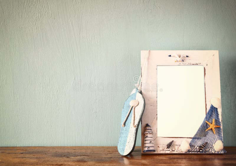 Old Nautical Frame With Starfish On Wooden Table And Wooden Background ...