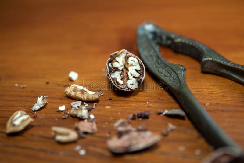 Vintage Nut Cracker with Pecan Nuts on a Wood Table Stock Image - Image ...