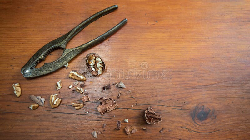 Vintage Nut Cracker with Pecan Nuts on a Wood Table Stock Image - Image ...