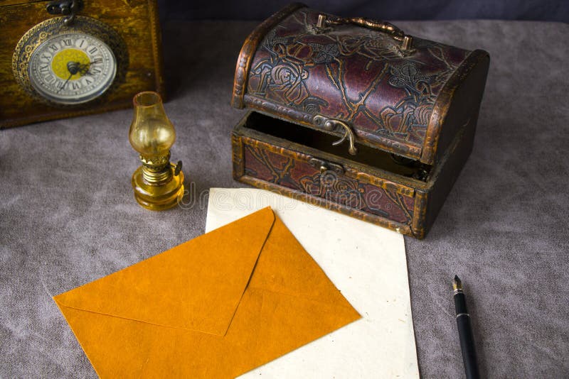 Vintage Objects on the Table, Old Box, Lamp, Clock, Envelope, and Pen ...