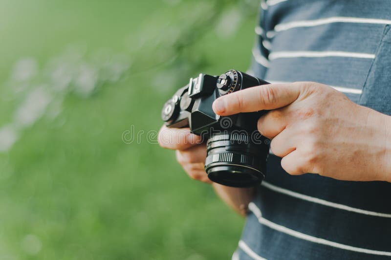 Vintage old camera in hand stock image. Image of equipment - 189476299