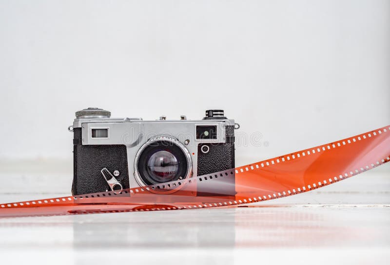Vintage Old Camera with 35mm Red Film. Old Equipment Stock Image ...