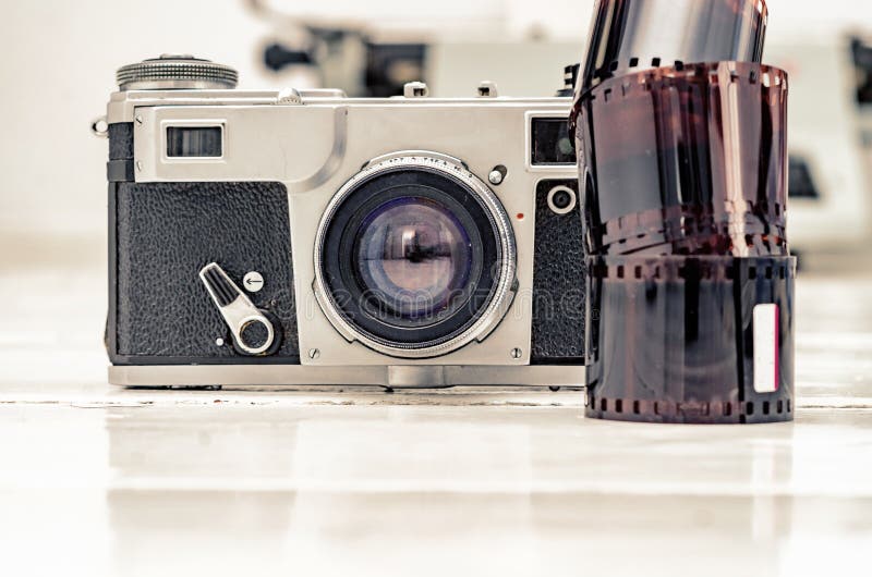 Vintage Old Camera with 35mm Red Film. Old Equipment Stock Image ...