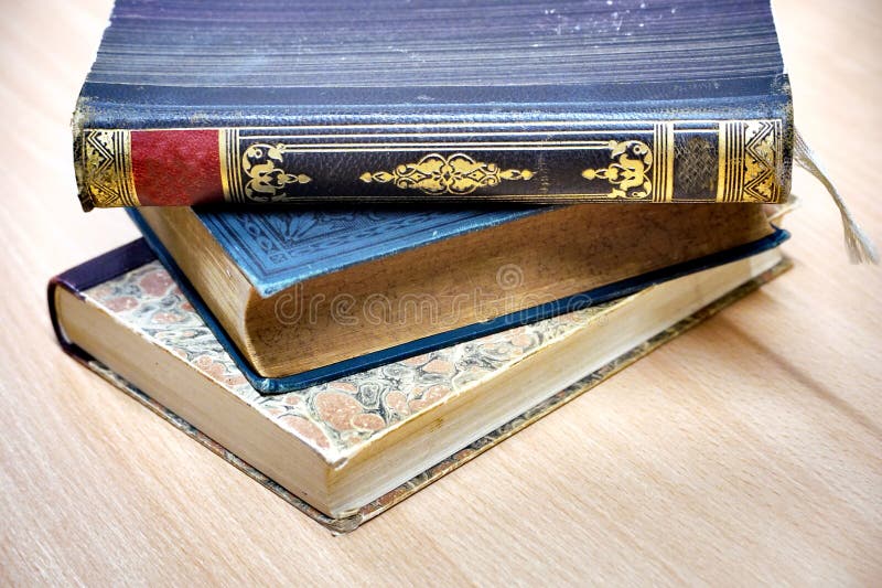 Vintage Old and Damaged Books on the Work Desk Stock Image - Image of ...