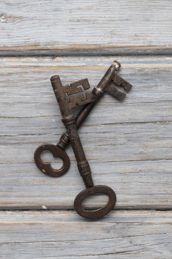 Vintage Old Fashioned Keys on a Rustic Wooden Background. Security ...