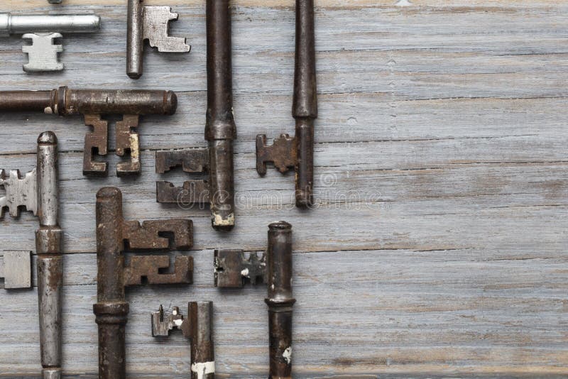 Vintage Old Fashioned Keys on a Rustic Wooden Background. Security ...