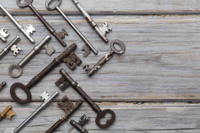 Vintage Old Fashioned Keys on a Rustic Wooden Background. Security ...