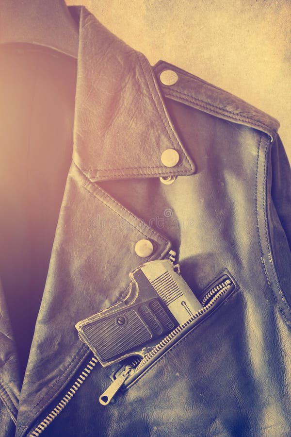 Vintage Old Leather Jacket with Gun in the Pocket on Grain Paper ...