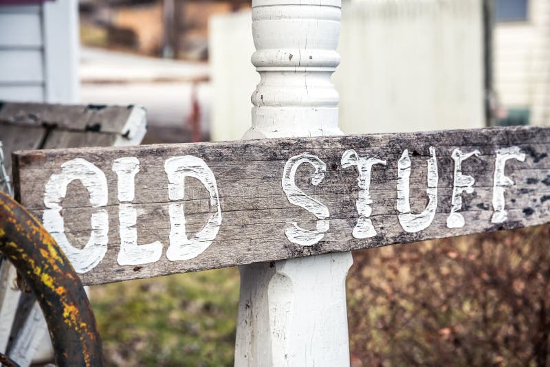 Vintage “Old Stuff” Wood Sign on White Wood Post Stock Image - Image of ...