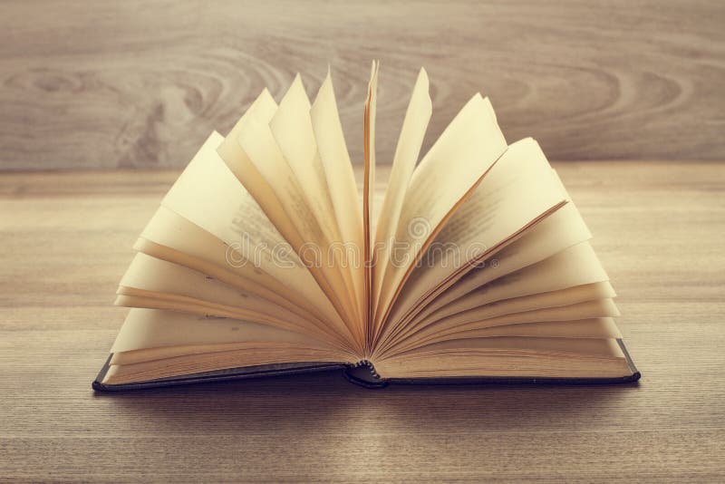 Open book on a desk stock image. Image of classic, desk - 105244155