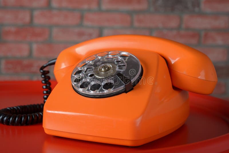 Vintage Orange Telephone on Red Background Stock Image - Image of ...