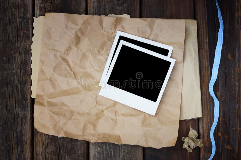 Vintage Paper and Instant Photo on Wood Background Stock Photo - Image ...