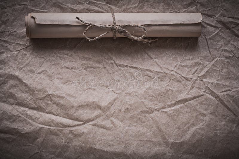 Vintage Paper Roll on Crumpled Wrapping Sheet Stock Image - Image of ...