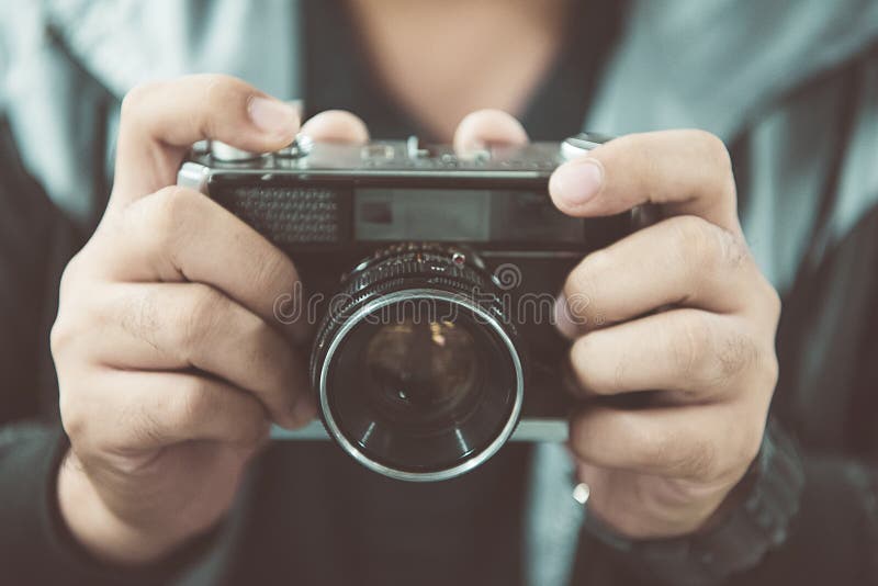 Vintage Photo Camera in the Hands of Man, Soft Focus. Stock Photo ...