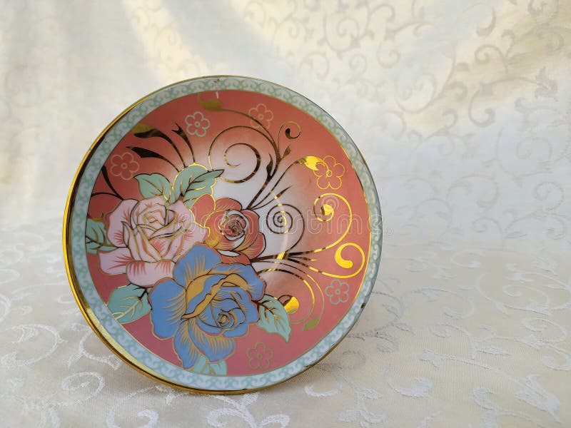 Vintage Plate with Floral Textures are Uniquely Arranged on the Table ...