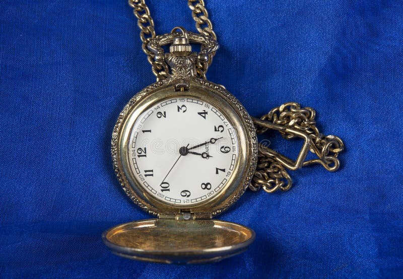 Vintage Pocket Clock on Blue Fabric Time Concept Stock Photo - Image of ...