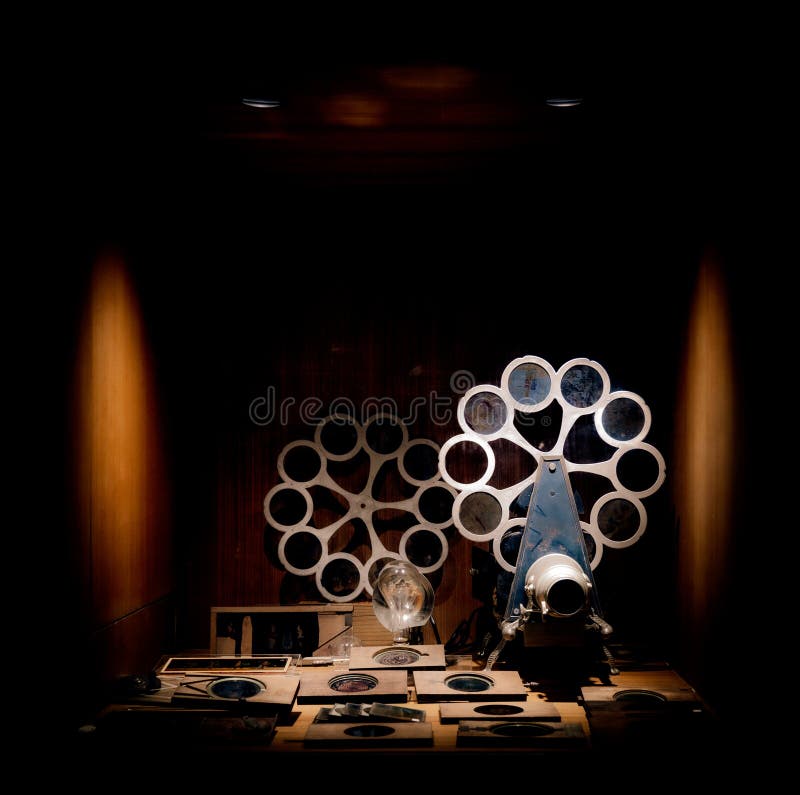 A Vintage Projector Illuminated in a Display Case Highlighting Its ...