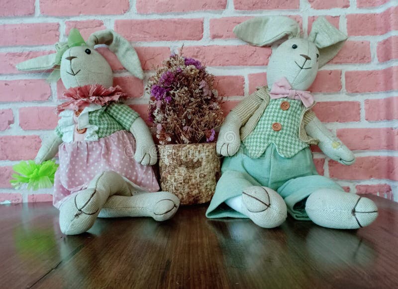 Vintage Rabbit Dolls Sitting on a Wooden Floor Stock Image - Image of ...