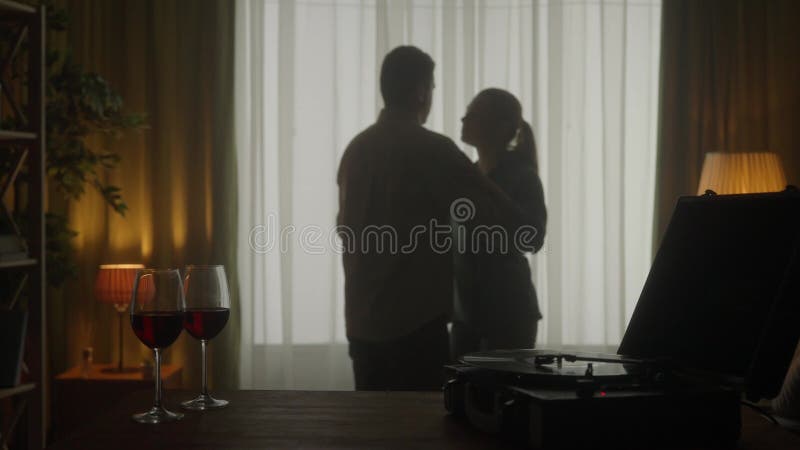 Vintage Record Player And Glasses With Red Wine On The Table Close Up