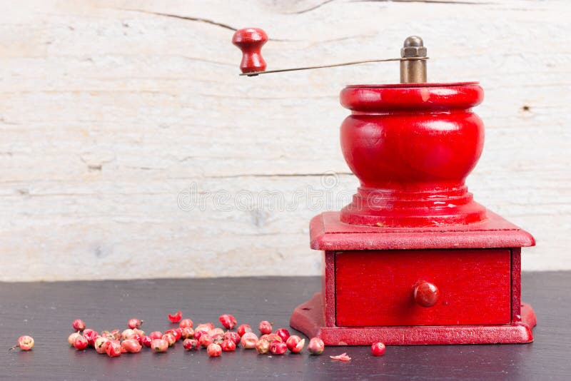 Vintage, Red Pepper Mill with Peppercorns Stock Image - Image of ...