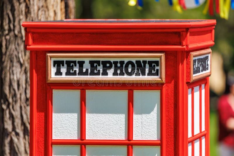 Vintage Red Telephone Booth in Sunny Park Setting Stock Image - Image ...