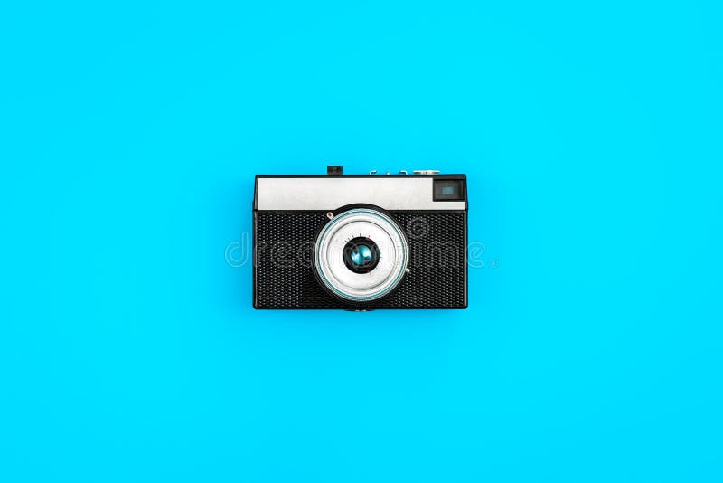Vintage Retro Camera on a Blue Background, Flat Lay. Stock Photo ...