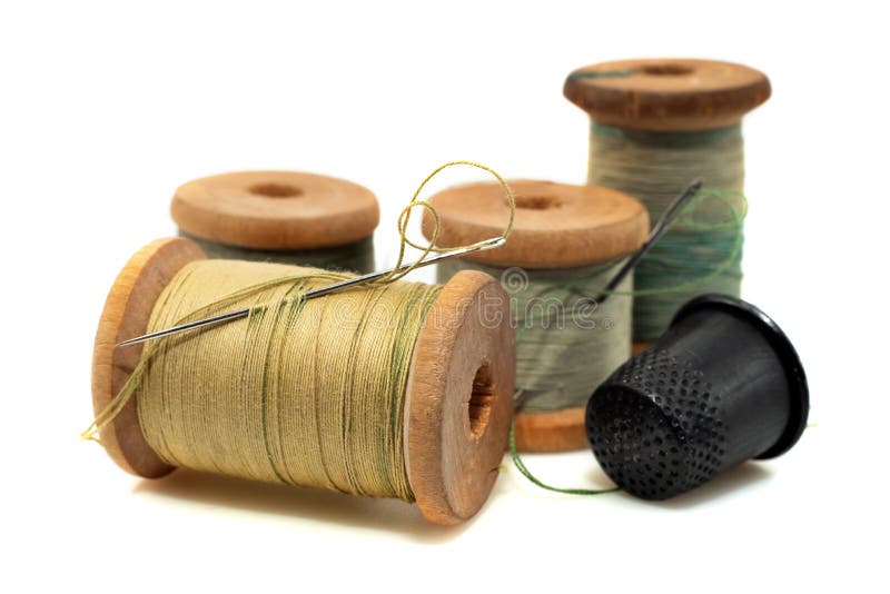 Vintage Retro Spool of Thread on a White Background. Needle with Thread ...