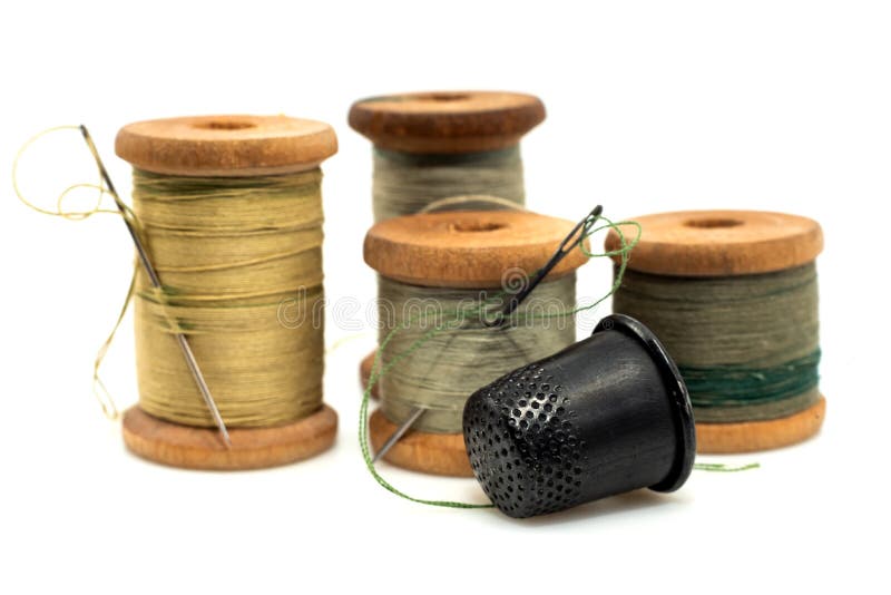 Vintage Retro Spool of Thread on a White Background. Needle with Thread ...