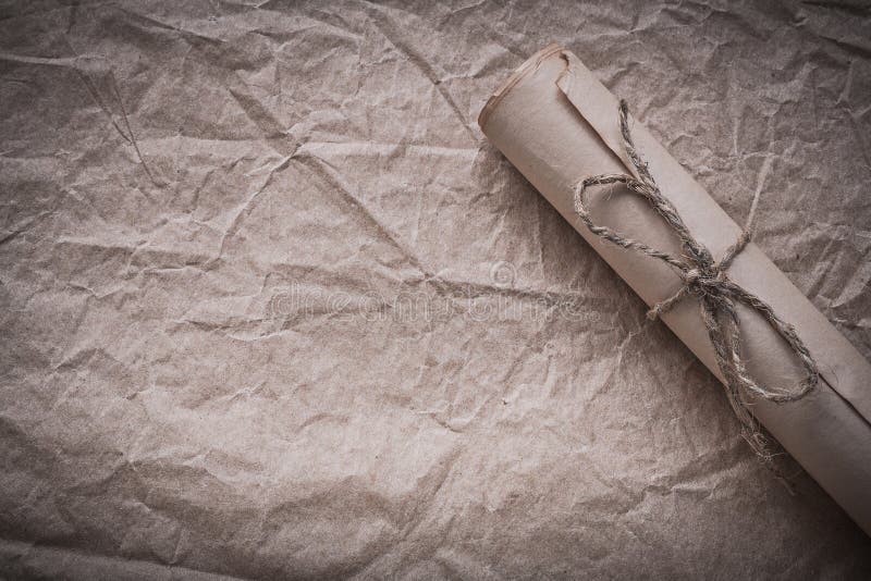Vintage Rolled Paper on Crumpled Wrapping Sheet Stock Photo - Image of ...