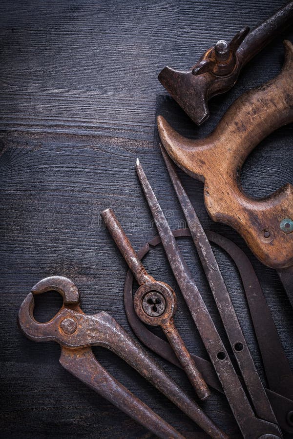 Vintage Rusted Tools on Dark Board Stock Photo - Image of dark ...