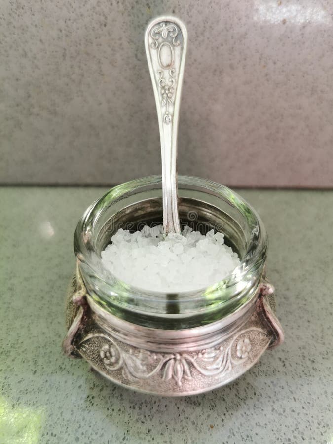 Vintage Salt Shaker with Spoon Filled with Coarse Salt on a Gray ...