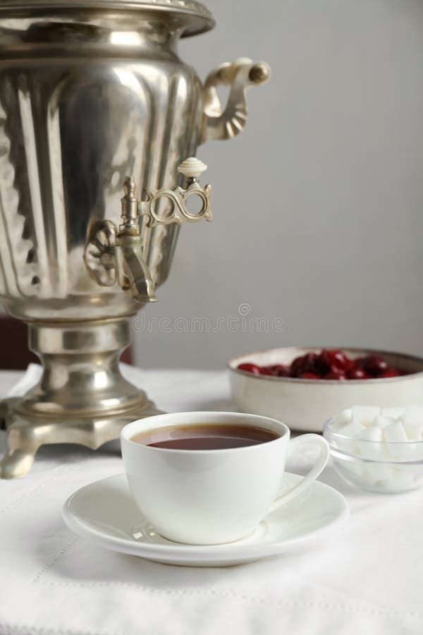 Vintage Samovar Cup Of Hot Drink And Snacks Served On Table