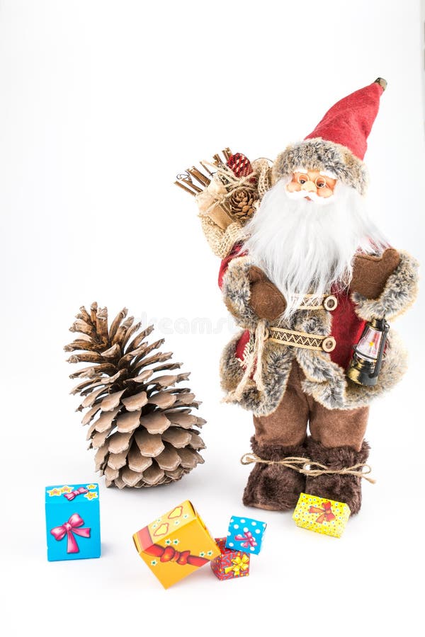 Vintage Santa Claus Doll with Pincone and Gift Boxes Stock Photo ...