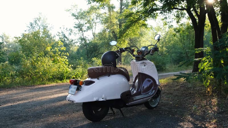 Vintage Scooter Standing in a Wild. Classic Scooter during the Sunrise ...