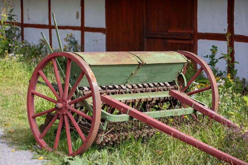 Vintage Seed Drill in Rustic Setting Stock Photo - Image of metal ...