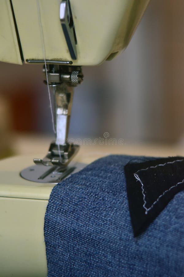 Vintage Sewing Machine Close Up with Jeans. Hobbies and Leisure. Stock ...
