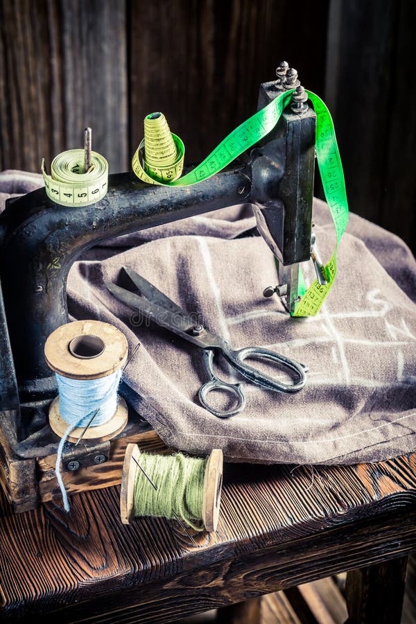 Vintage Sewing Machine with Scissors, Cloth and Threads Stock Image ...