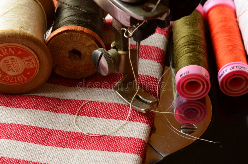 Vintage Sewing Machine and Thread Spools Stock Image - Image of ...