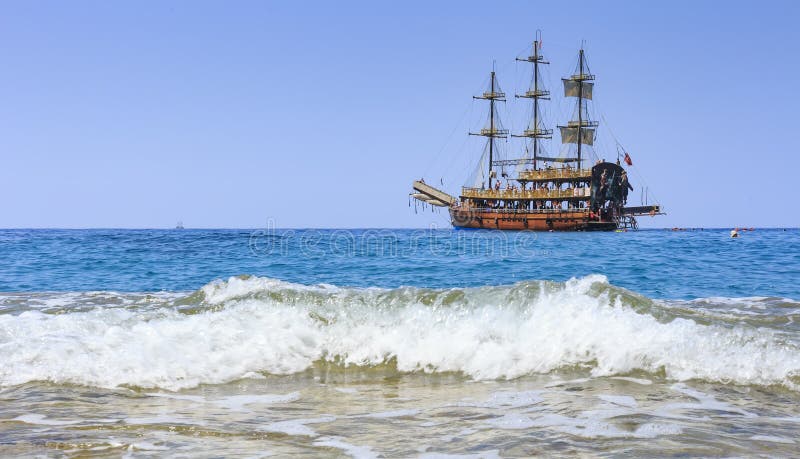 Vintage Ship Floating on Waves in Blue Sea Water. Stock Photo - Image ...