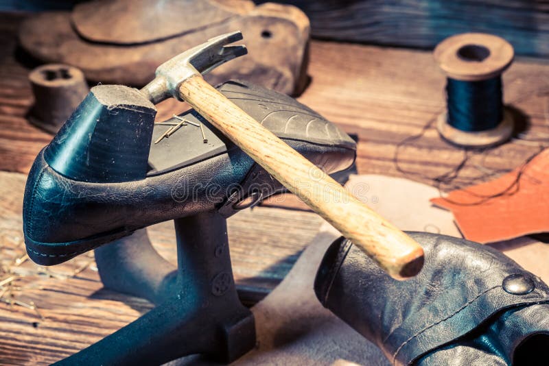 Vintage Shoemaker Workshop with Leather and Tools Stock Image - Image ...