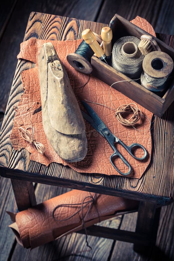 Vintage Shoemaker Workshop with Leather and Tools Stock Image - Image ...