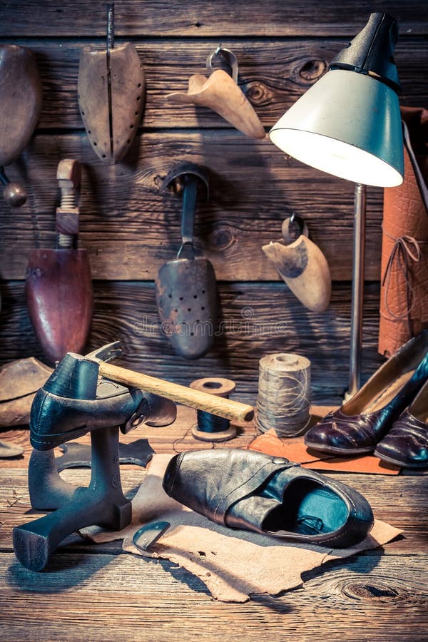 Vintage Shoemaker Workshop with Tools, Shoes and Laces Stock Image ...